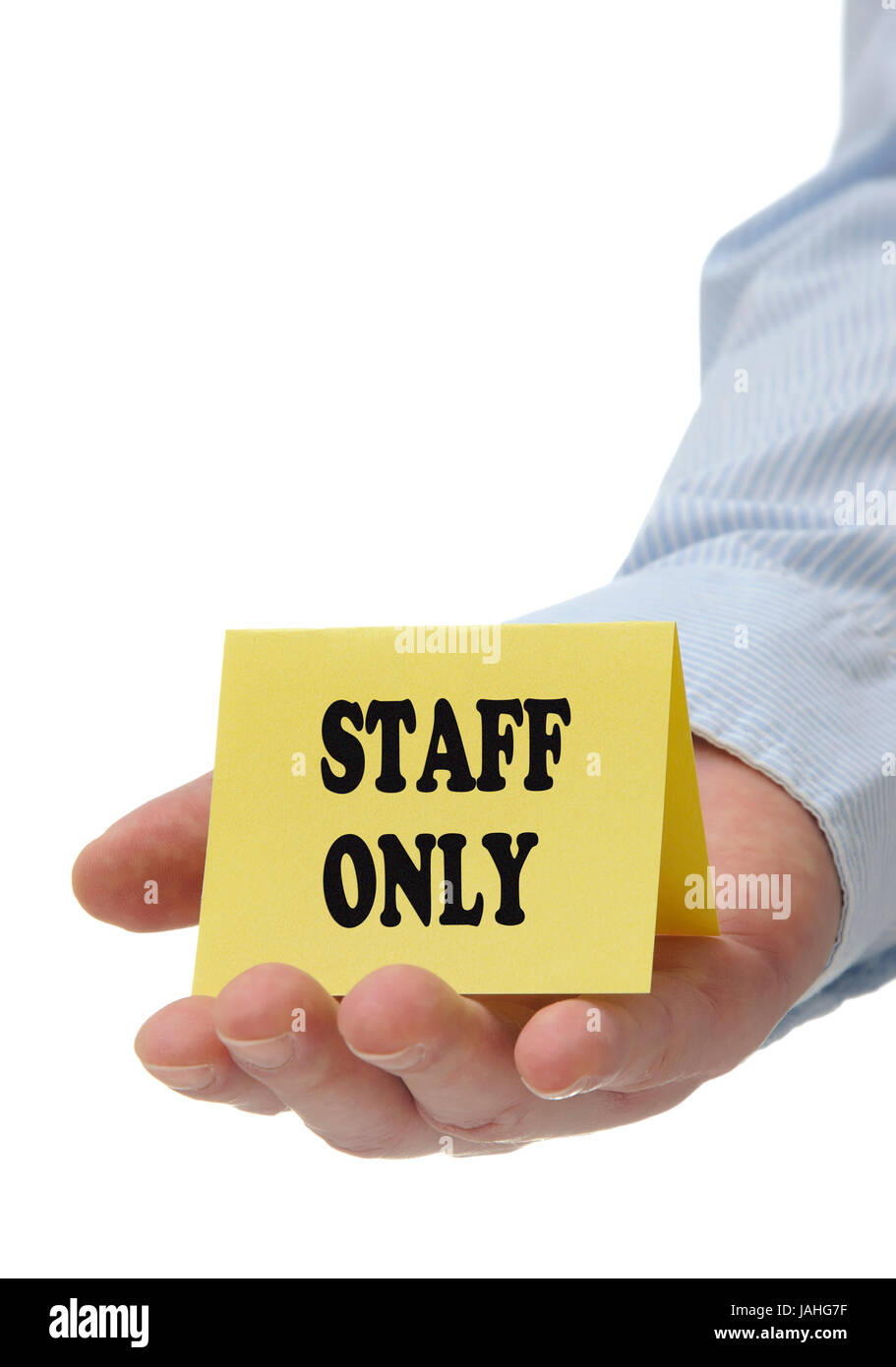 Business man holding staff only sign Stock Photo - Alamy