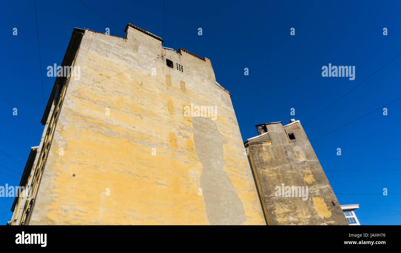 A yellow wall on an old building in Saint Peterburg. Vintage Firewall ...