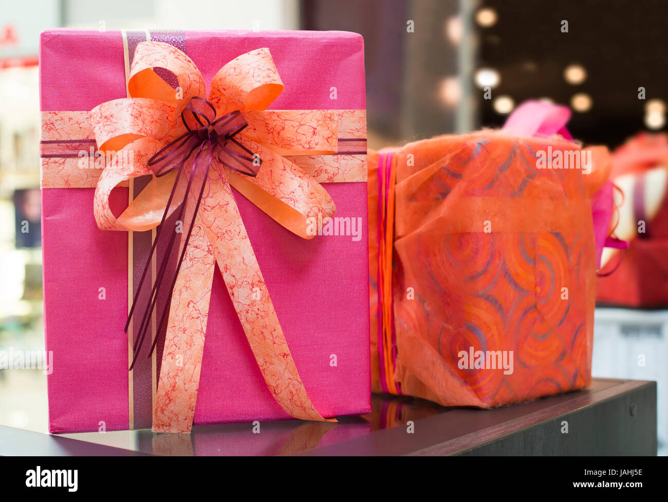 Pink and red Gift boxes in shopping center. Authentic image Stock Photo ...
