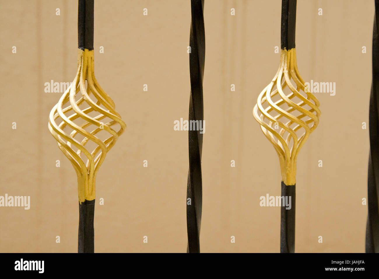 Bulbous design of gold-painted iron barricade rods Stock Photo - Alamy