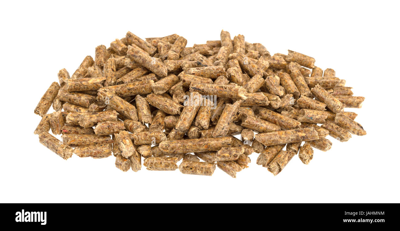 A small pile of wood pellets for heating isolated on a white background ...