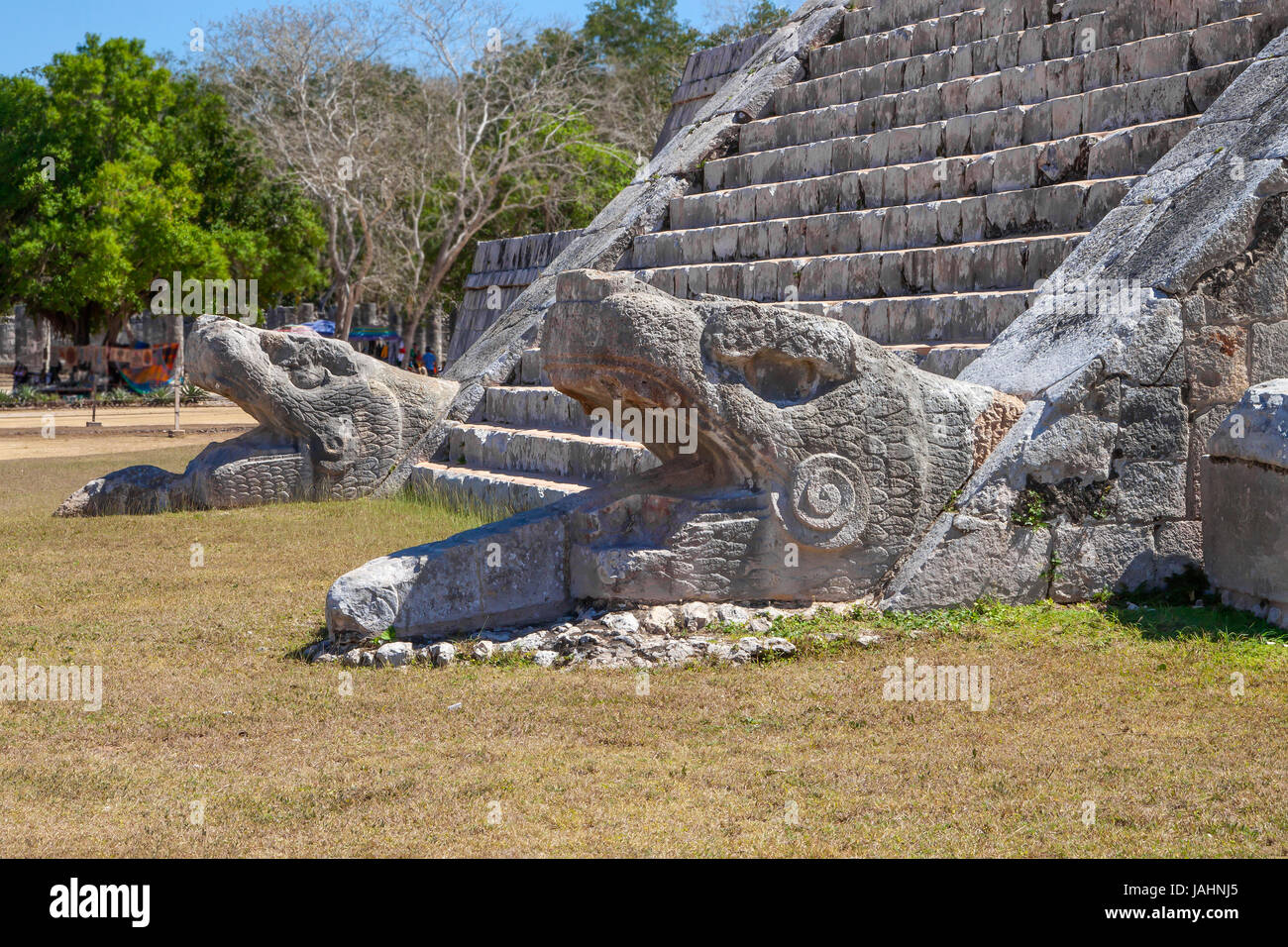Steps and snake heads at the bottom of the Pyramid of Kukulcan at ...