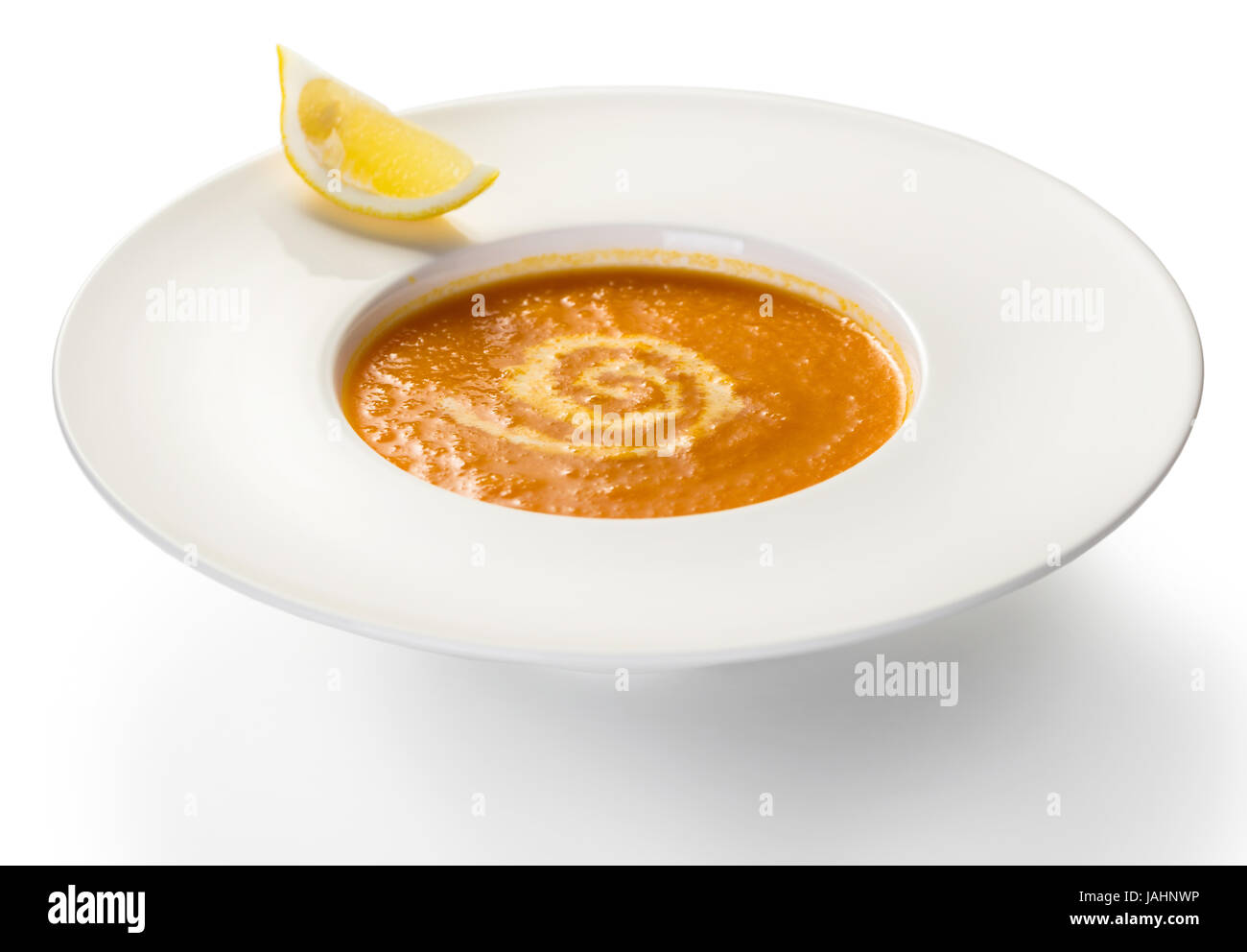 Carrot cream soup puree on white background Stock Photo - Alamy