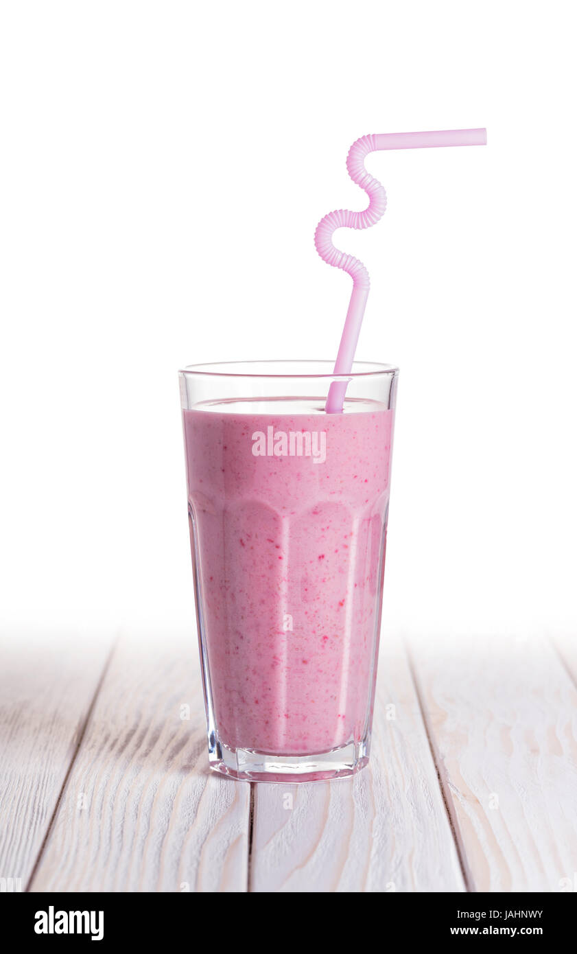 Milky raspberry cocktail on a white wooden background Stock Photo - Alamy