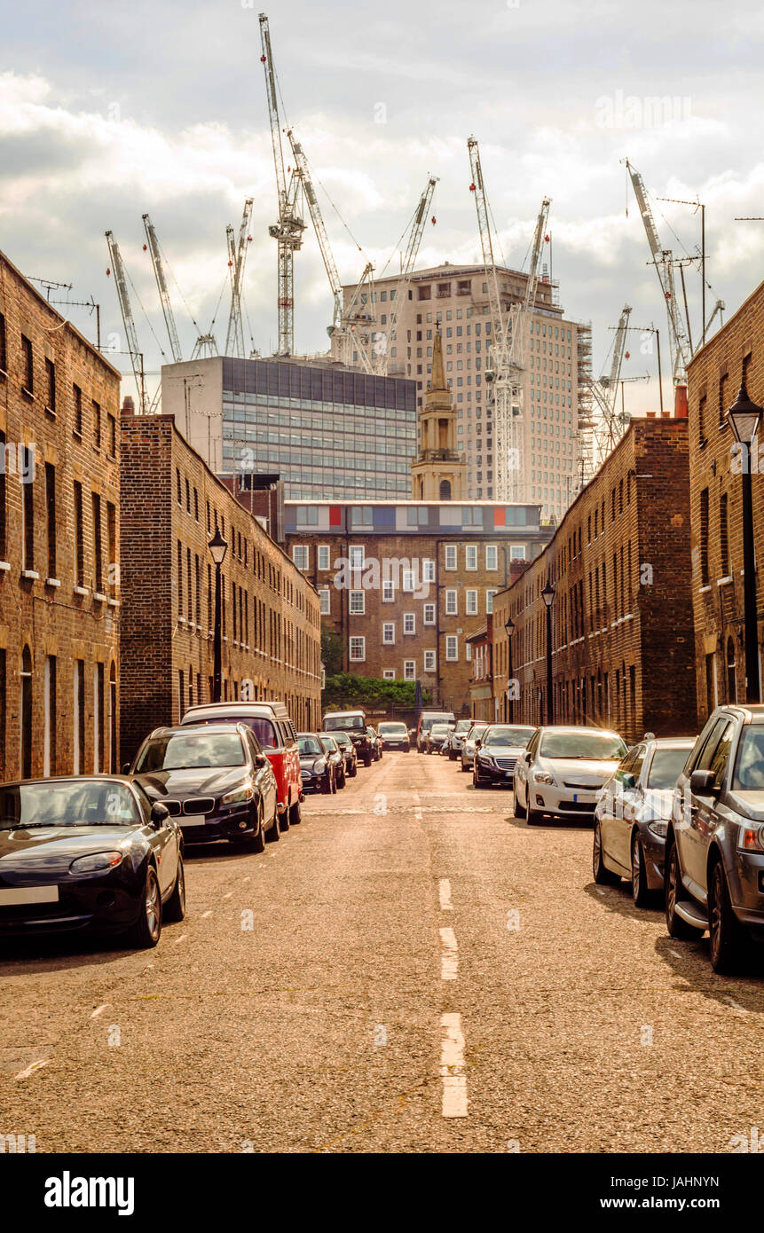 Typical old English buildings, low brick buildings across a narrow ...