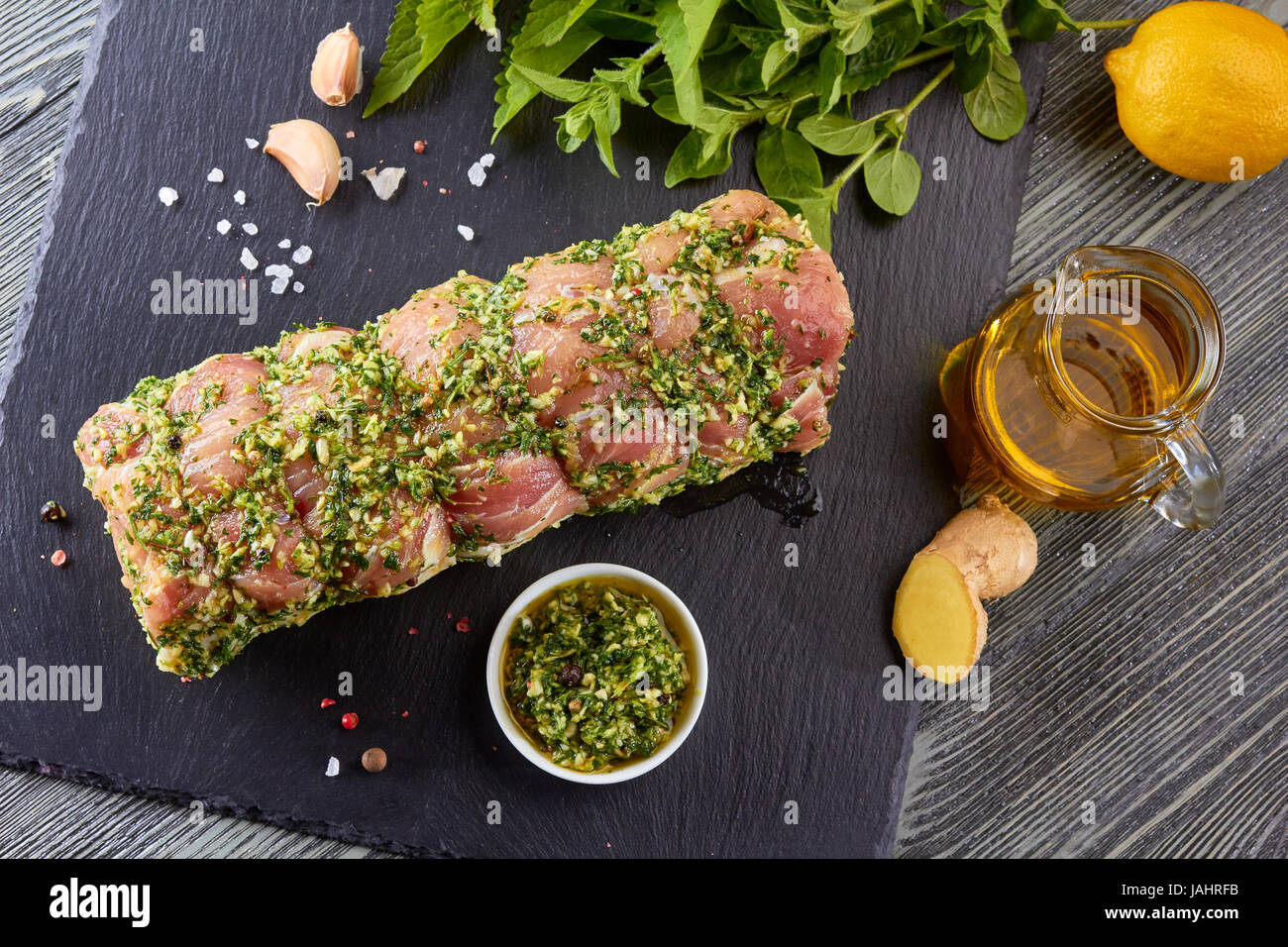 Raw pork loin with spices ready for baking Stock Photo - Alamy