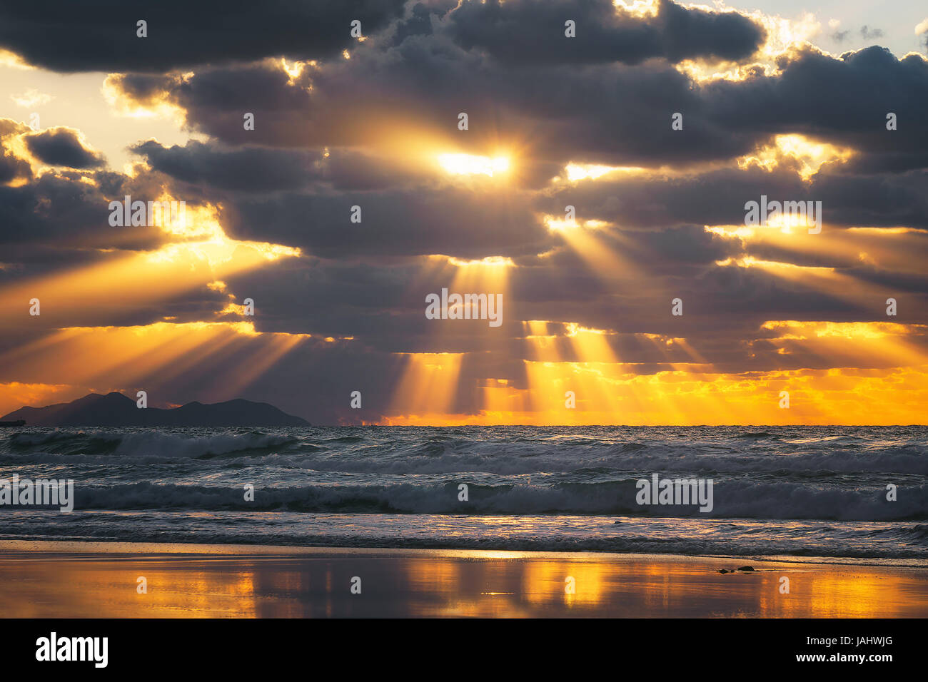 golden sun rays on the sea at the sunset Stock Photo - Alamy
