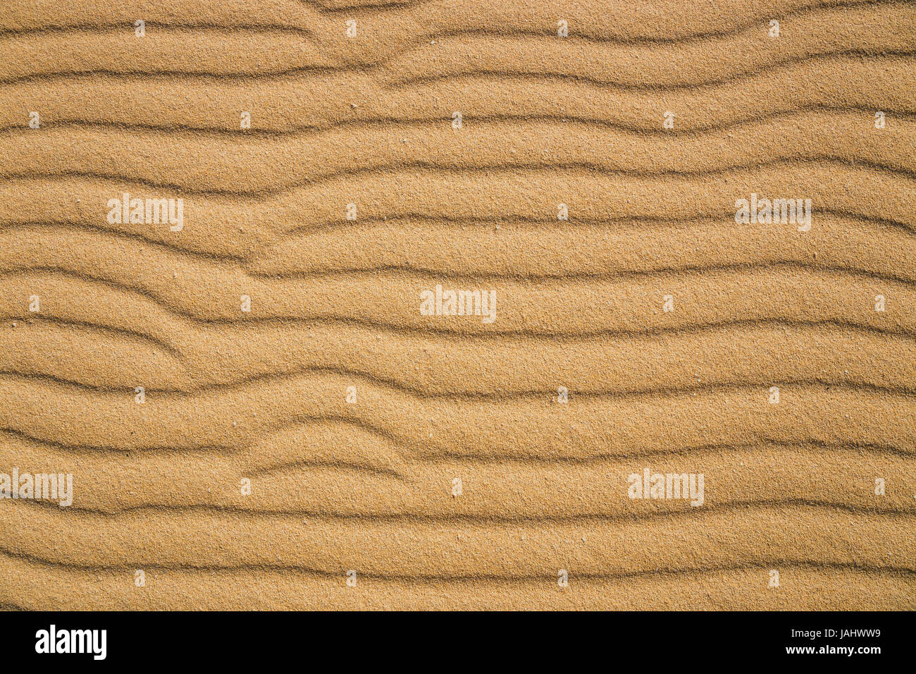 Lines in the sand of a beach, close up Stock Photo - Alamy