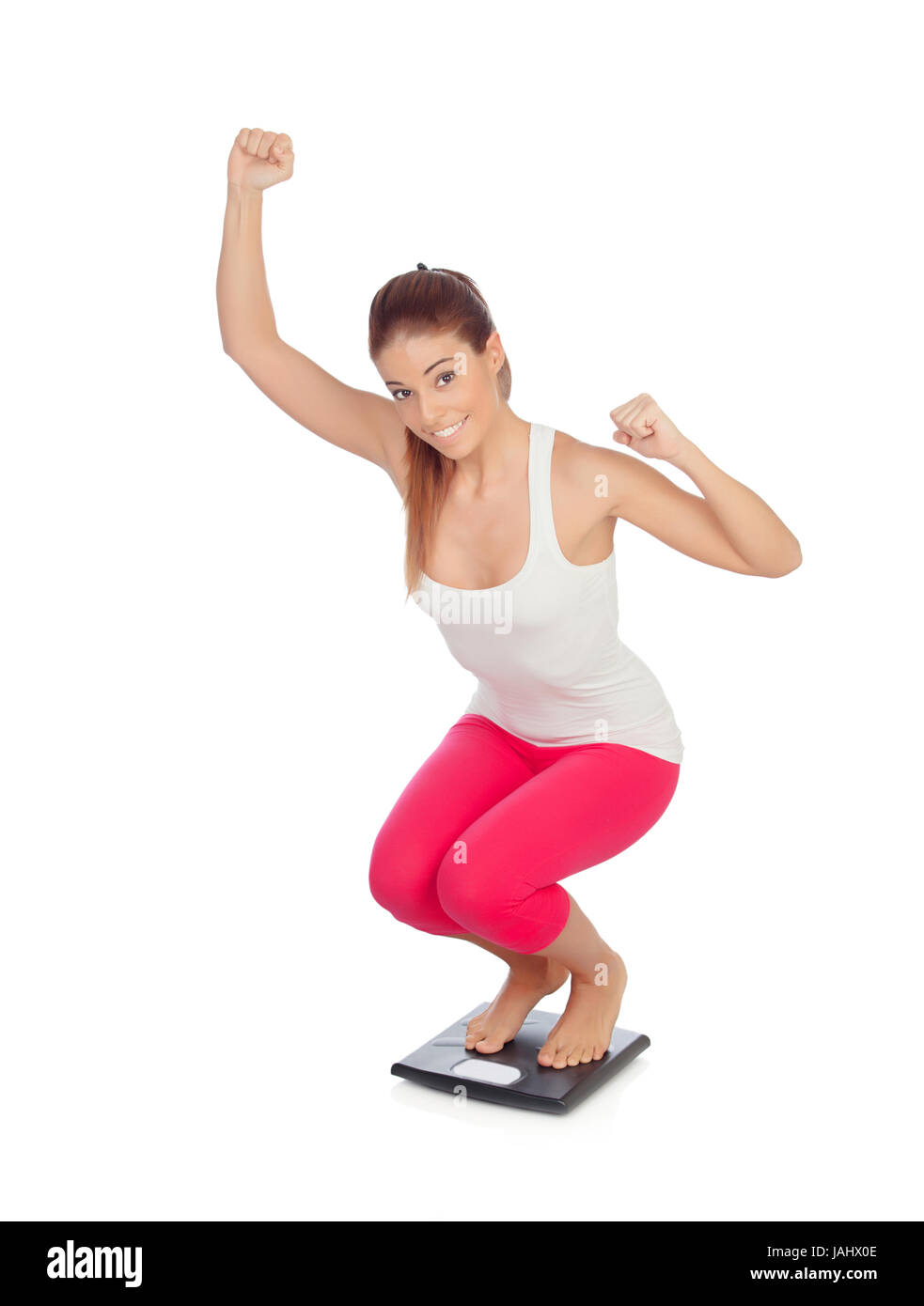 Pretty woman on seeing his new weight scale isolated on a white ...