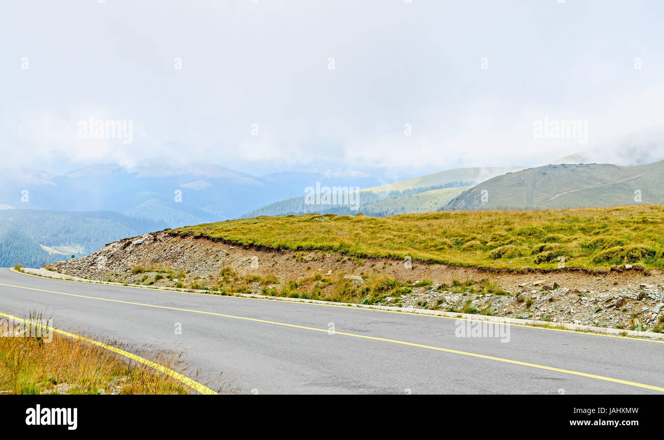Transalpina road, Parang Mountains, hills with green grass and rocks ...