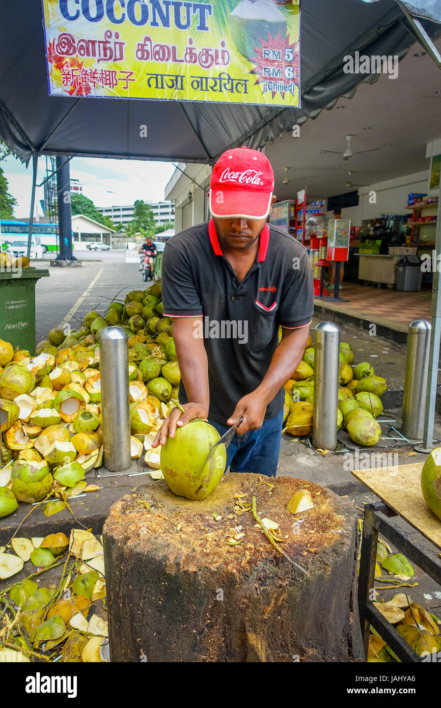 Kuala Lumpur, Malaysia - March 9, 2017: Unknown street vendor person ...