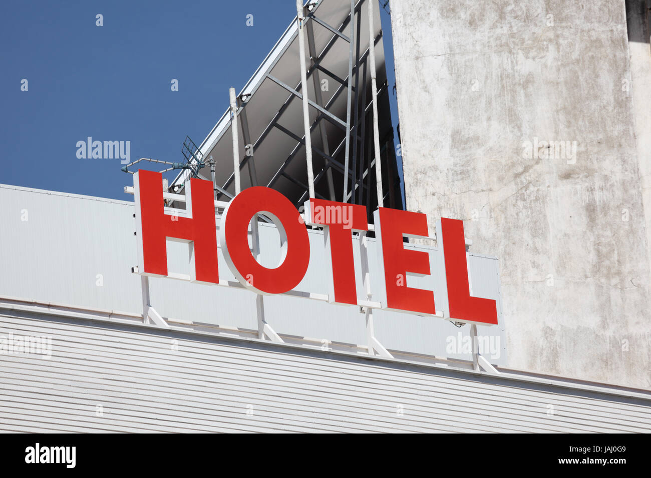 Red hotel sign on top of a building Stock Photo - Alamy
