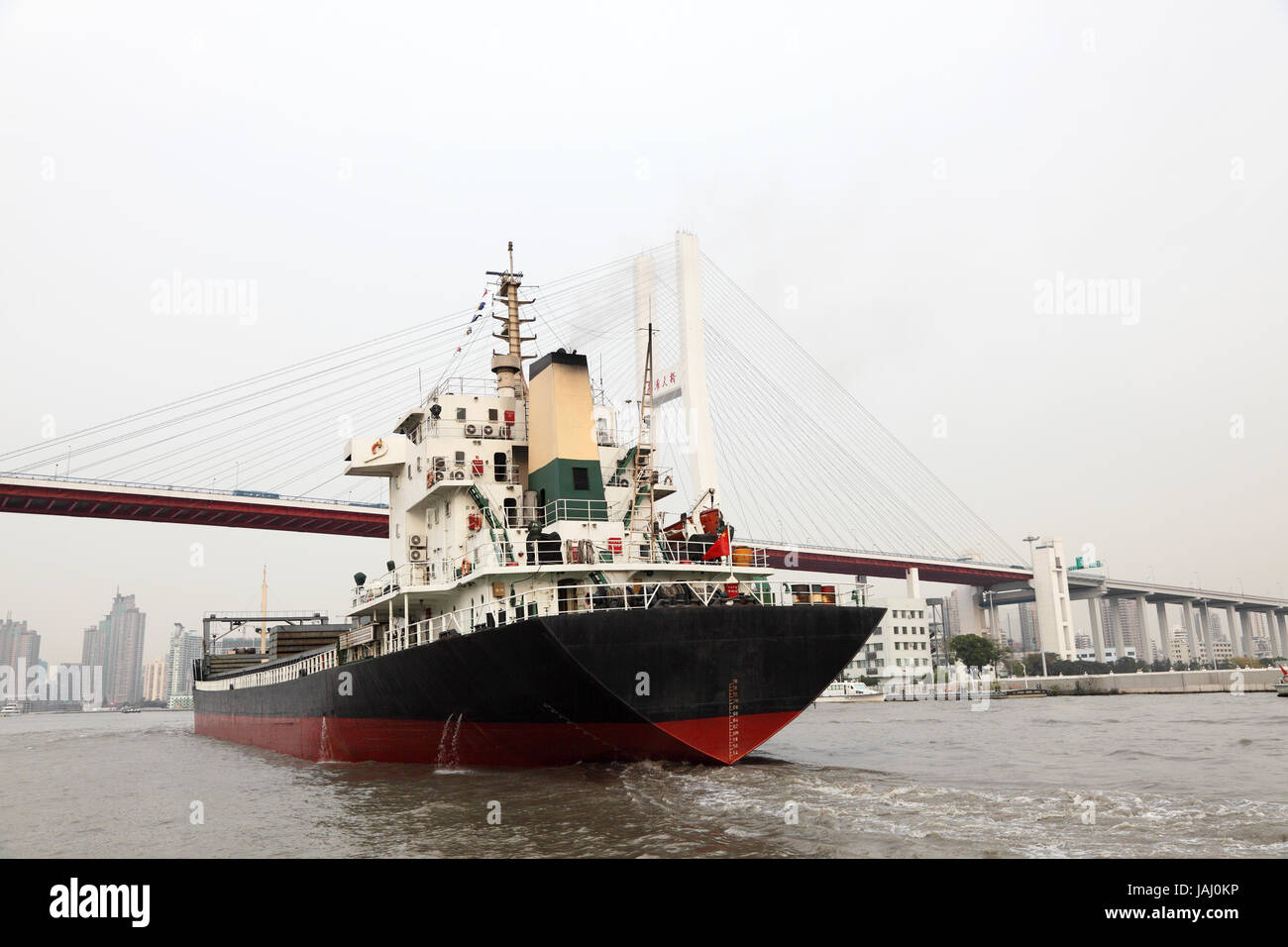 Cargo ship on Huangpu river in Shanghai, China Stock Photo - Alamy