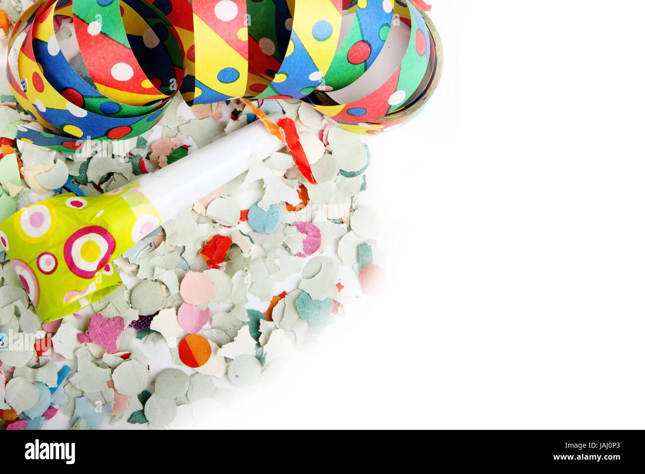 streamers and confetti as party decoration for birthday with white ...