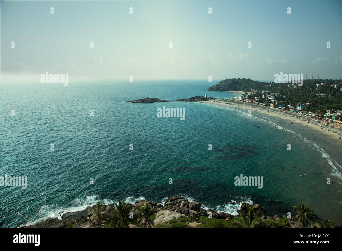 Sandy beach and blue sea view from above. India, Thiruvananthapuram ...