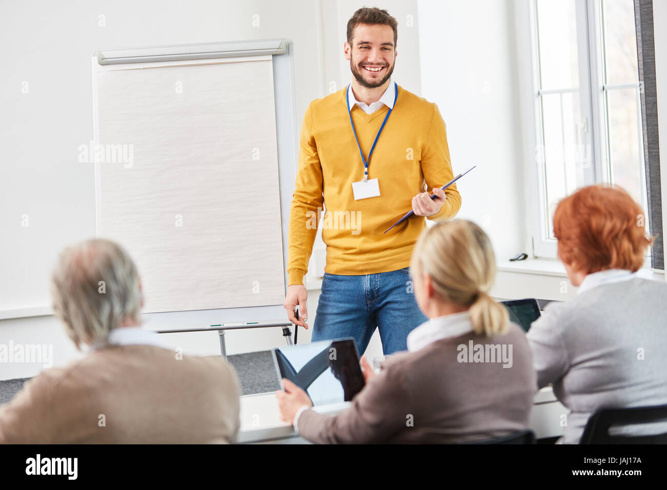 Lecturer makes a business presentation with flipchart about consulting ...