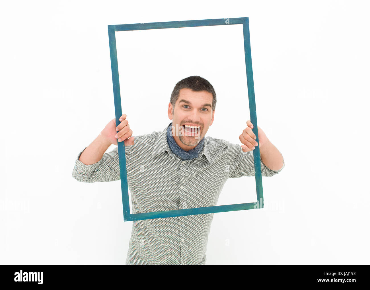 man getting his head out of an empty frame shouting, on white ...