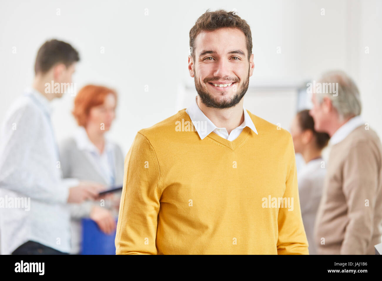 Man as successful start-up founder with his business team Stock Photo ...