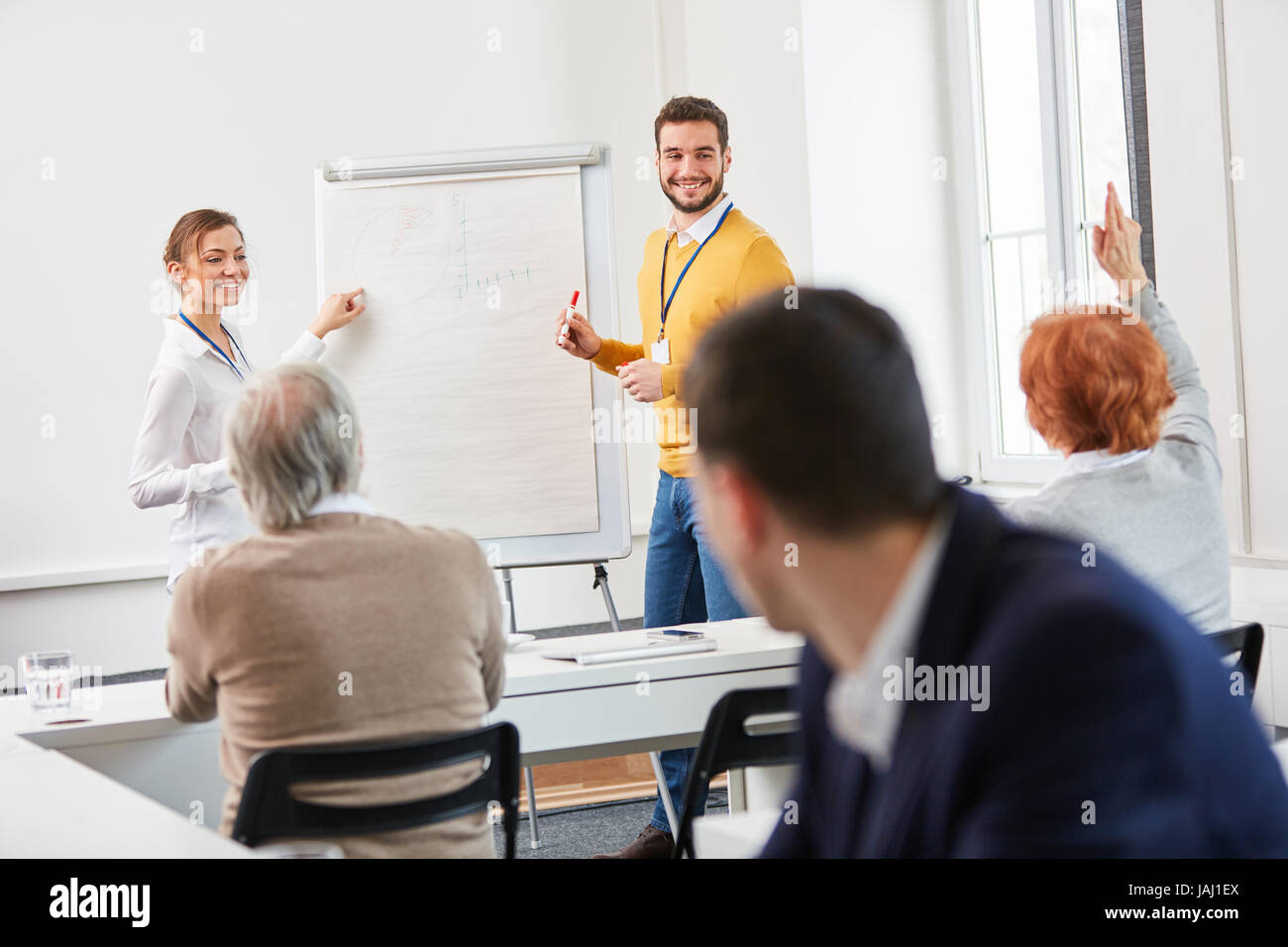 Consulting team gives lecture presentation at business seminar Stock ...