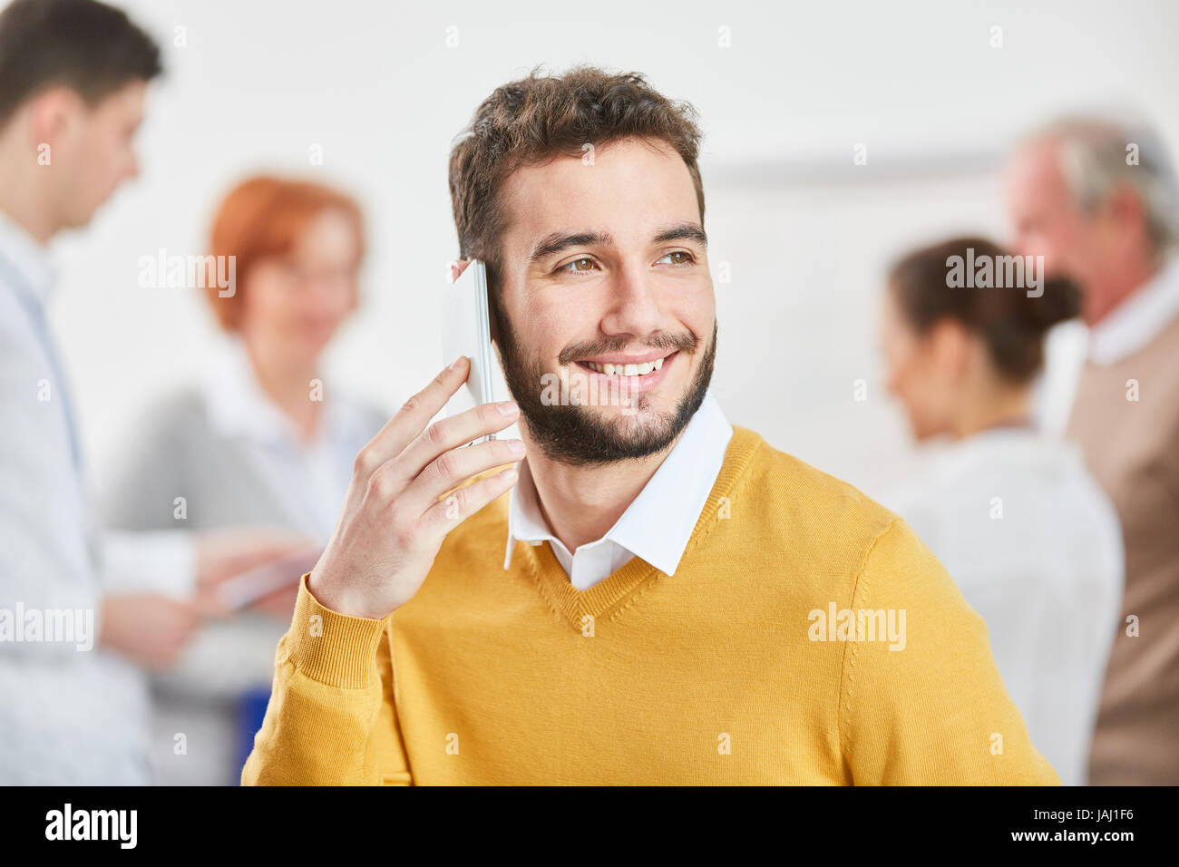 Start-up founder making business call with smartphone Stock Photo - Alamy