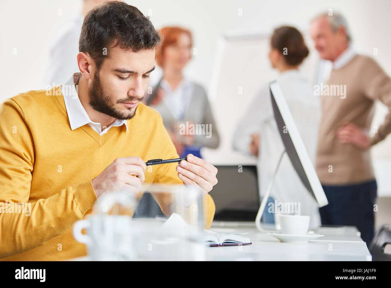 Young business man thinking and considering while planning Stock Photo ...