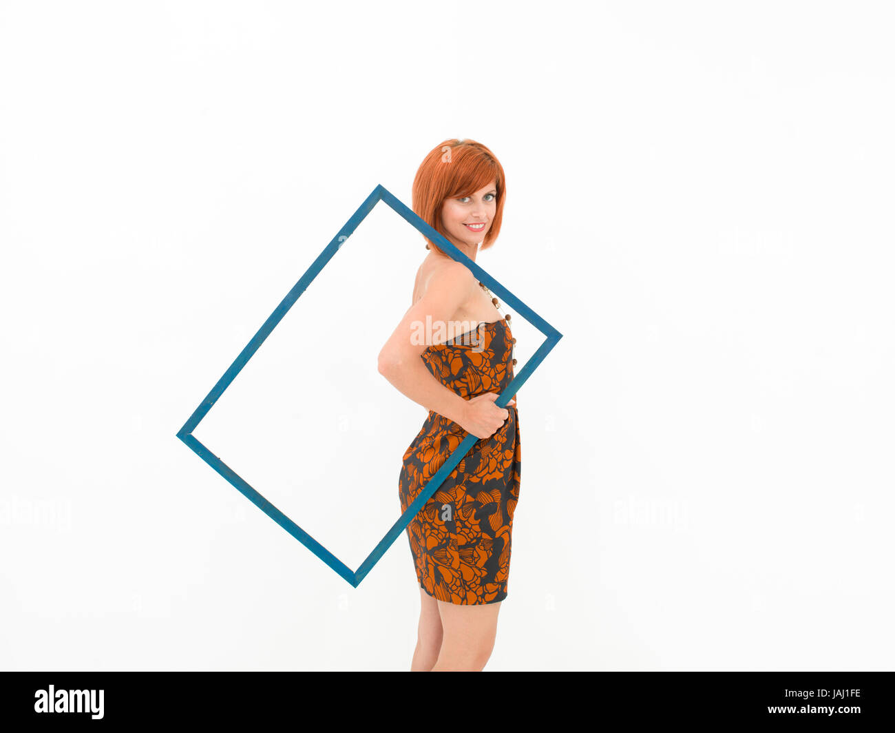 side view of beautiful caucasian woman holding on her shoulder an empty ...