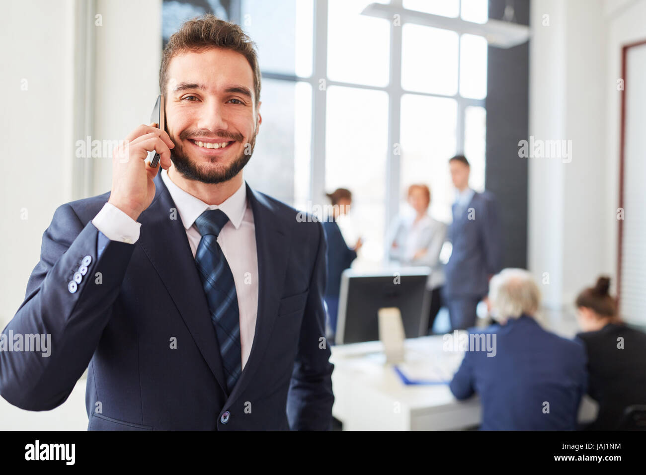 Successful manager consultant makes call with smartphone Stock Photo ...
