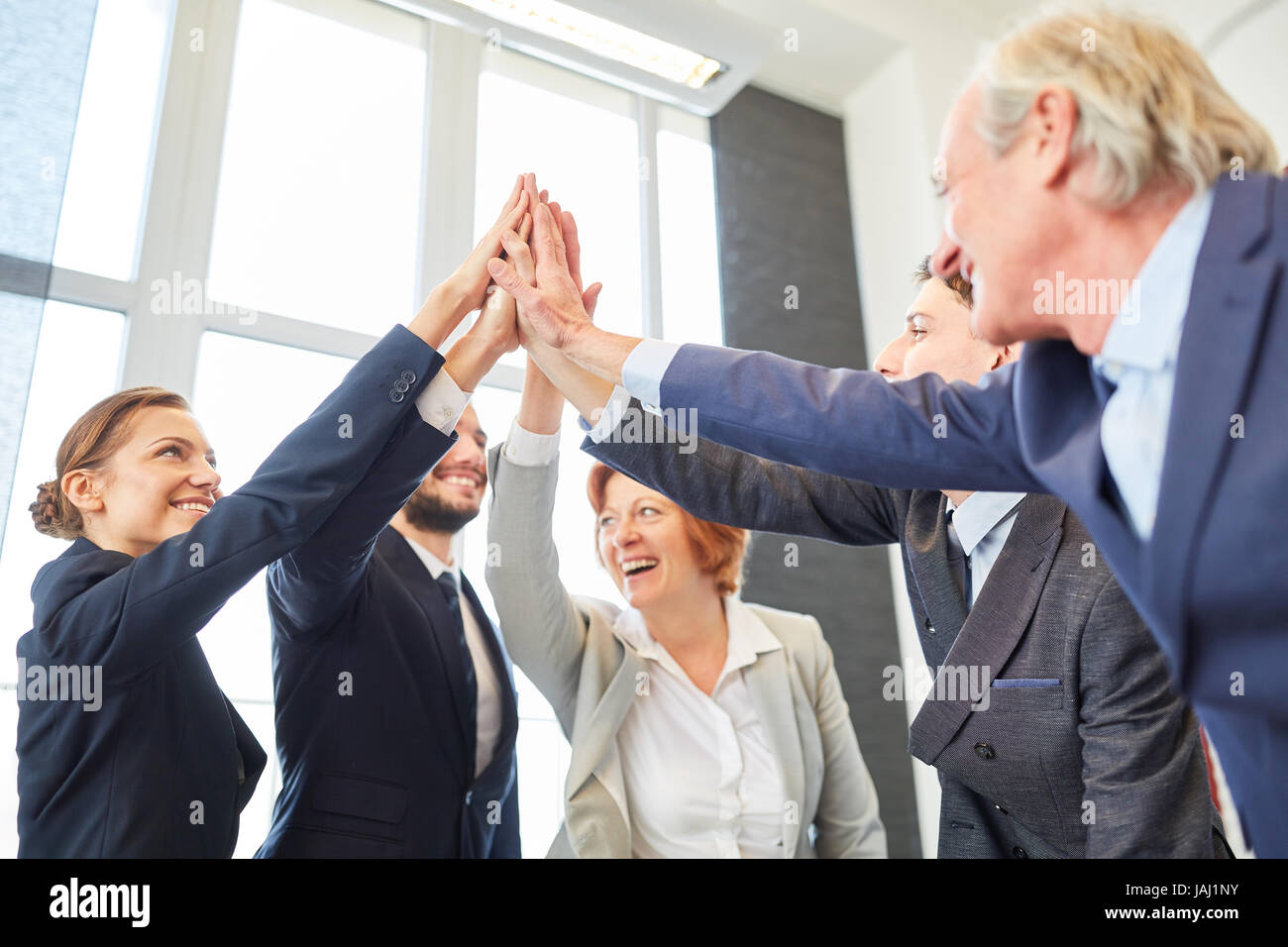 Business team share High Five for team building or team spirit Stock ...