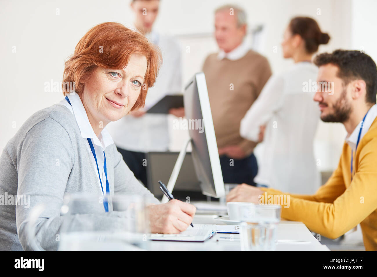 Team meeting taking place hi-res stock photography and images - Alamy