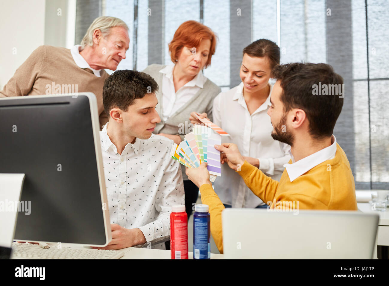 Designer team in creative workshop with color palette making decisions ...