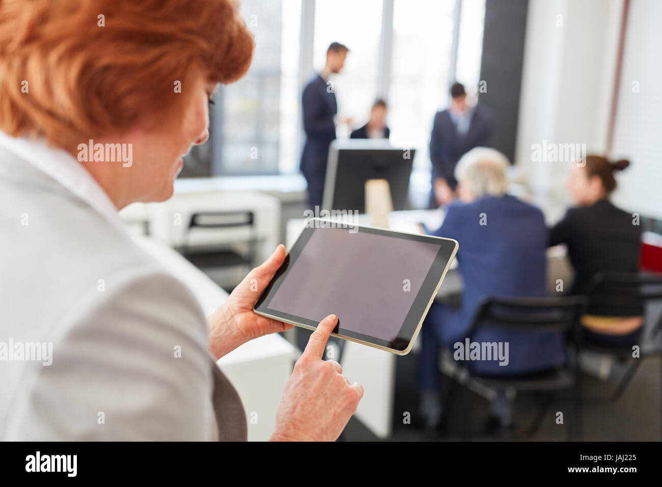 Business woman uses tablet computer as digital tool for communication ...