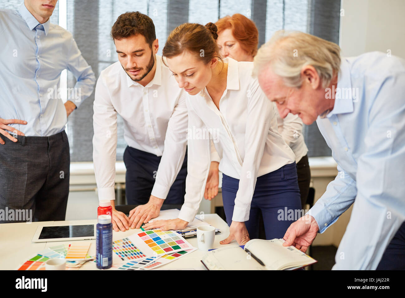 Creative designer team choosing color palette in cooperation Stock ...