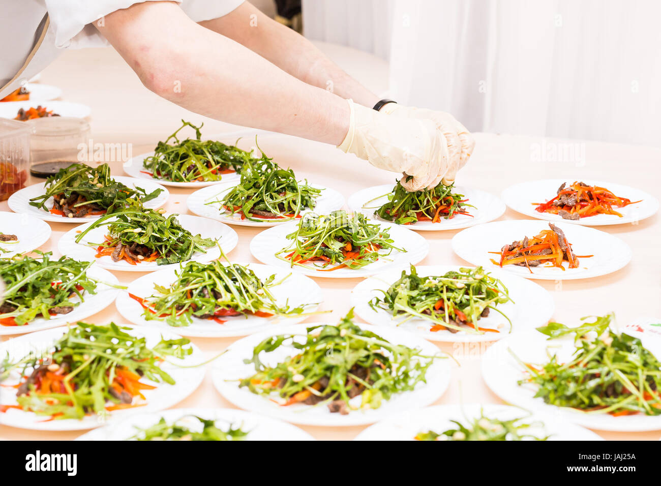 Close-up of chef cooking food kitchen restaurant cutting cook hands ...