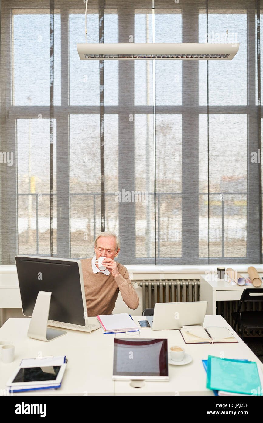 Senior businessman working in office with computer Stock Photo - Alamy Senior businessman working in office with computer Stock Photo - Alamy