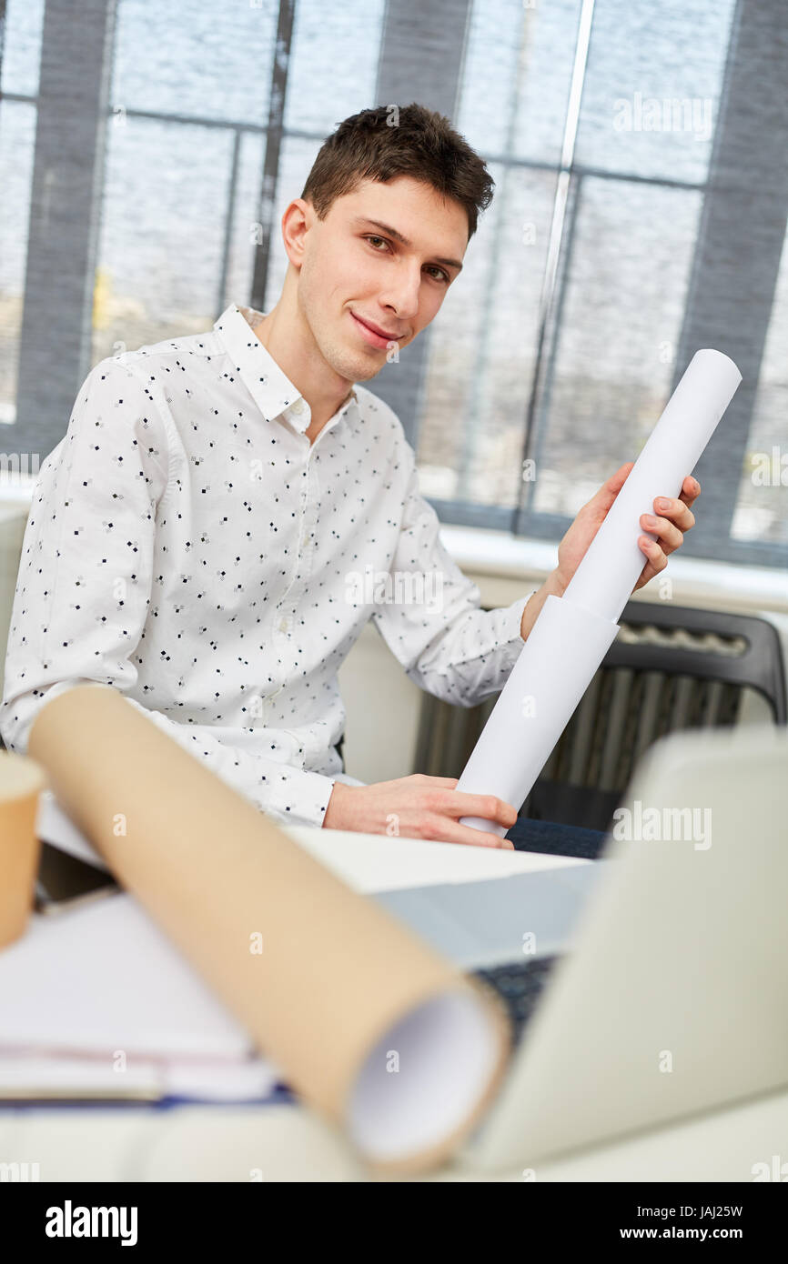Young architect with achitectural drawing in his apprenticeship Stock ...