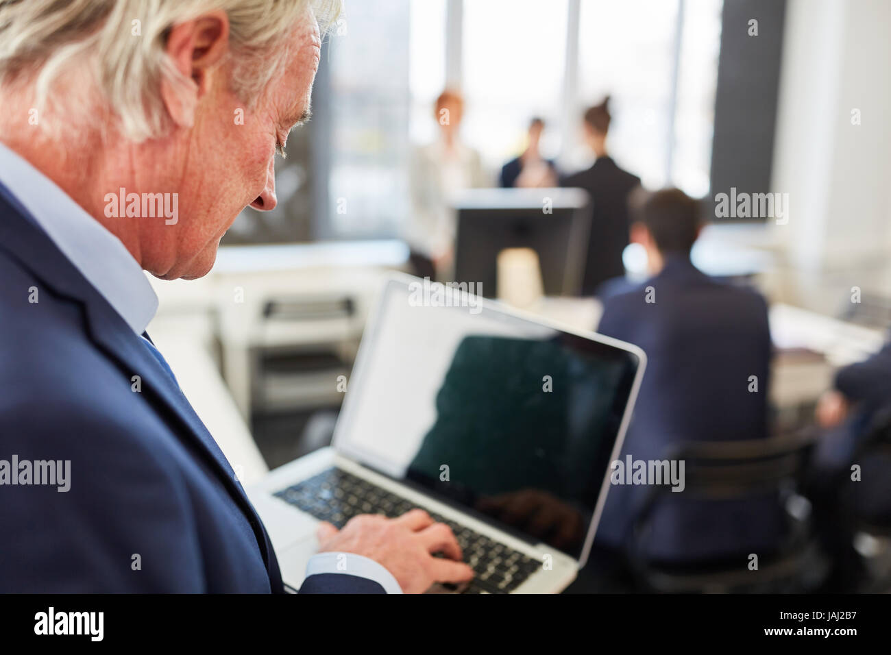 Businessman with laptop computer working on digital business ...