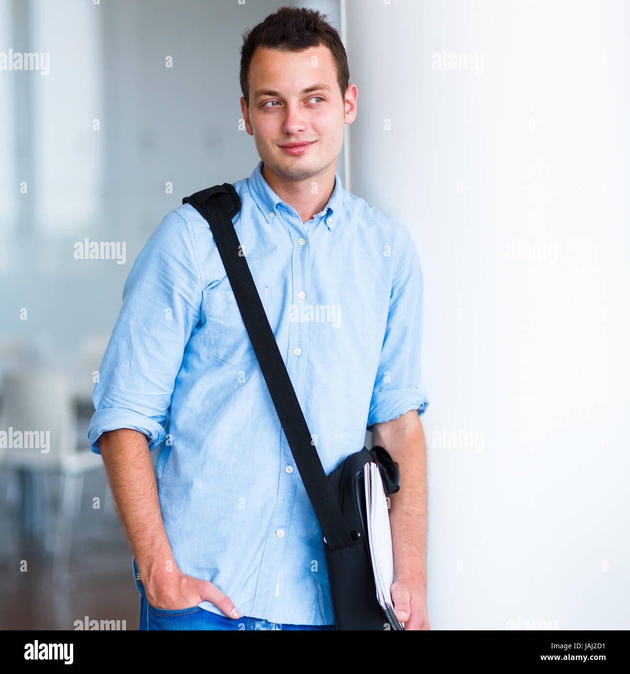 Handsome college student on campus (shallow DOF; color toned image ...