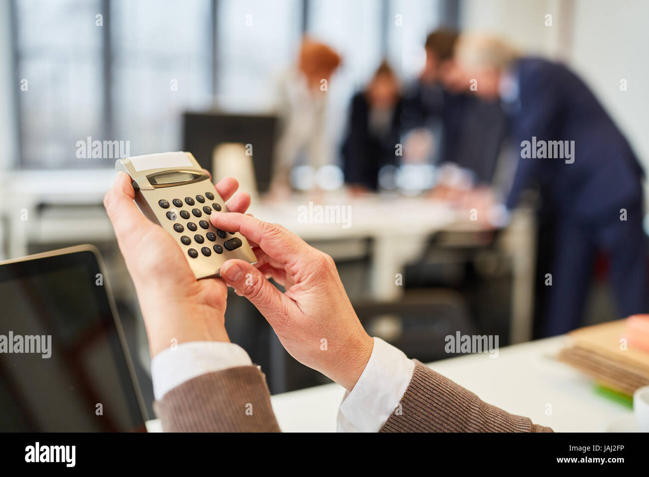 Hand of business man calculating with calculator for finance meeting ...