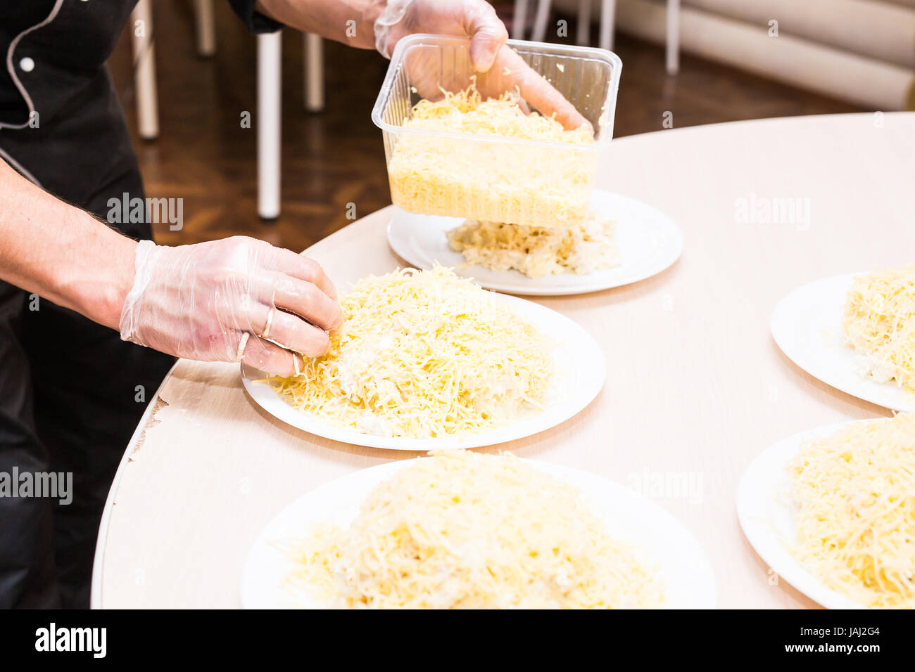 Close-up of chef cooking food kitchen restaurant cutting cook hands ...