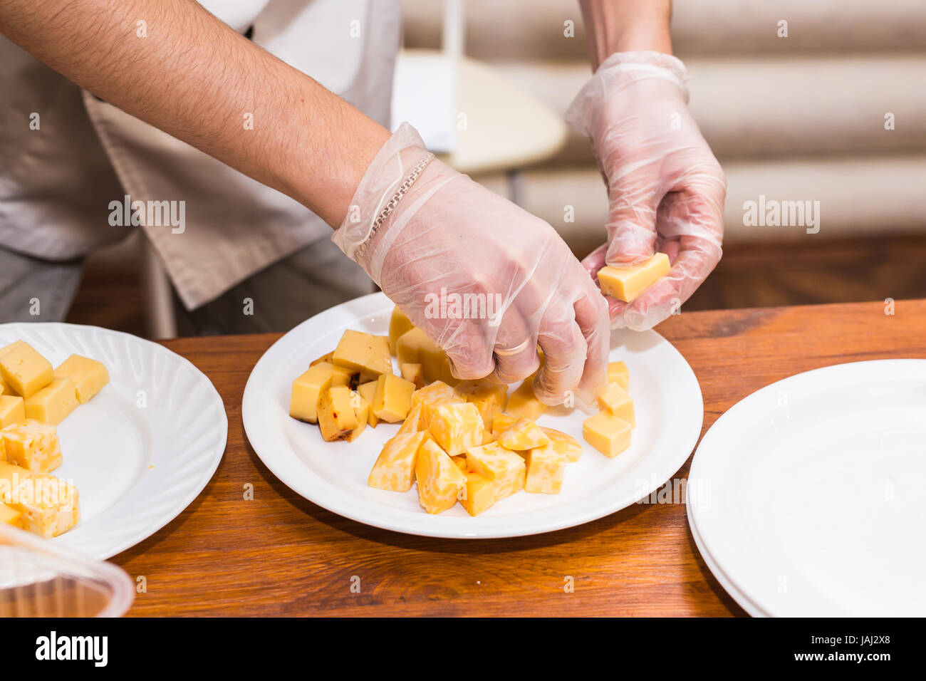 Close-up of chef cooking food kitchen restaurant cutting cook hands ...