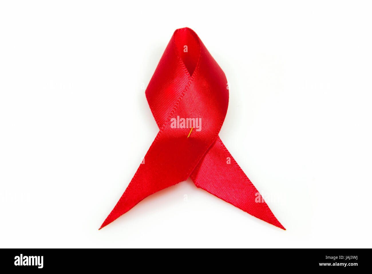 Aids awareness red ribbon.Isolated on white Stock Photo - Alamy