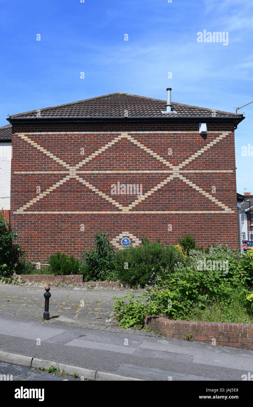 Artistic brickwork on side of residential house Stock Photo - Alamy