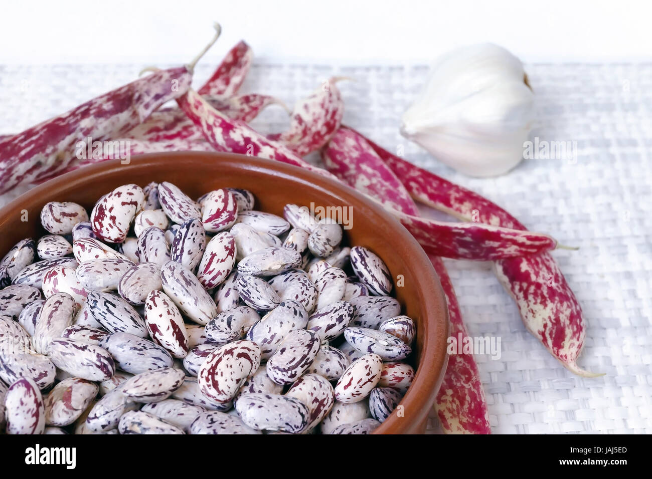 Bowl full of raw beans, on white background. View from above Stock ...