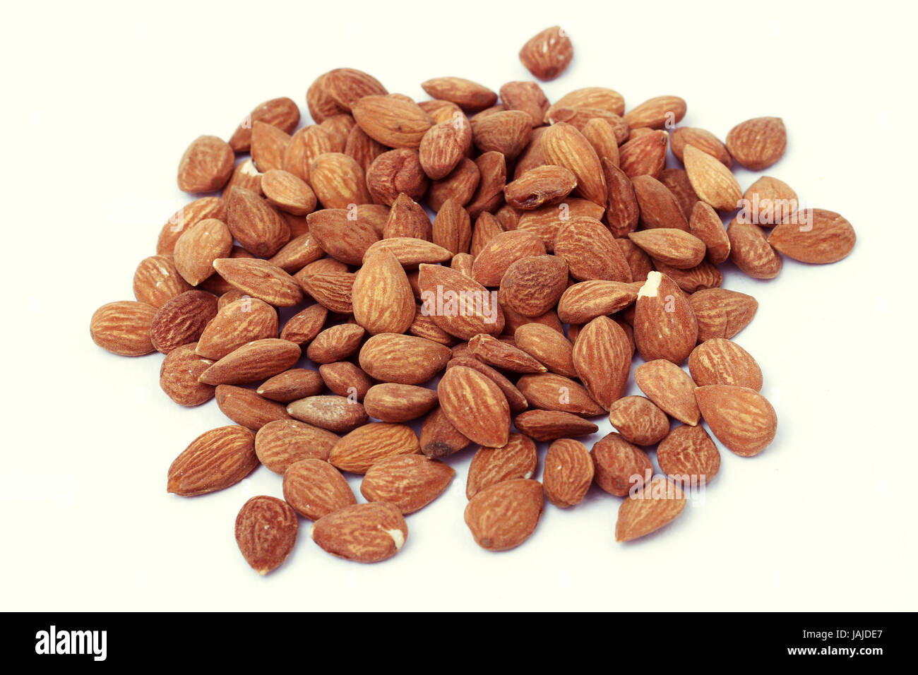 Almonds isolated on white background Stock Photo - Alamy