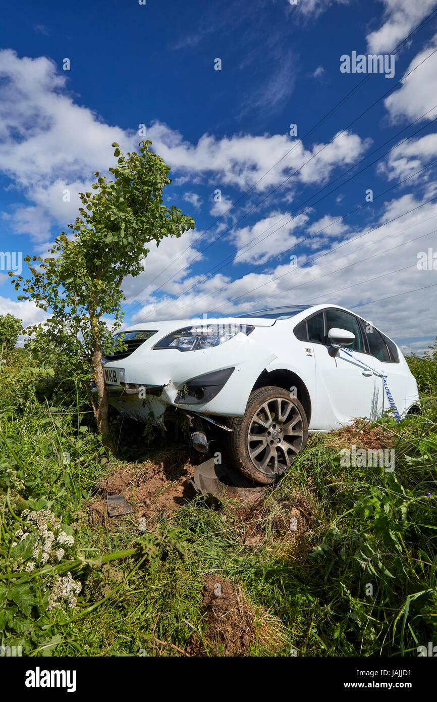 Car Crashed Through Hedge in Rural Location UK Stock Photo - Alamy