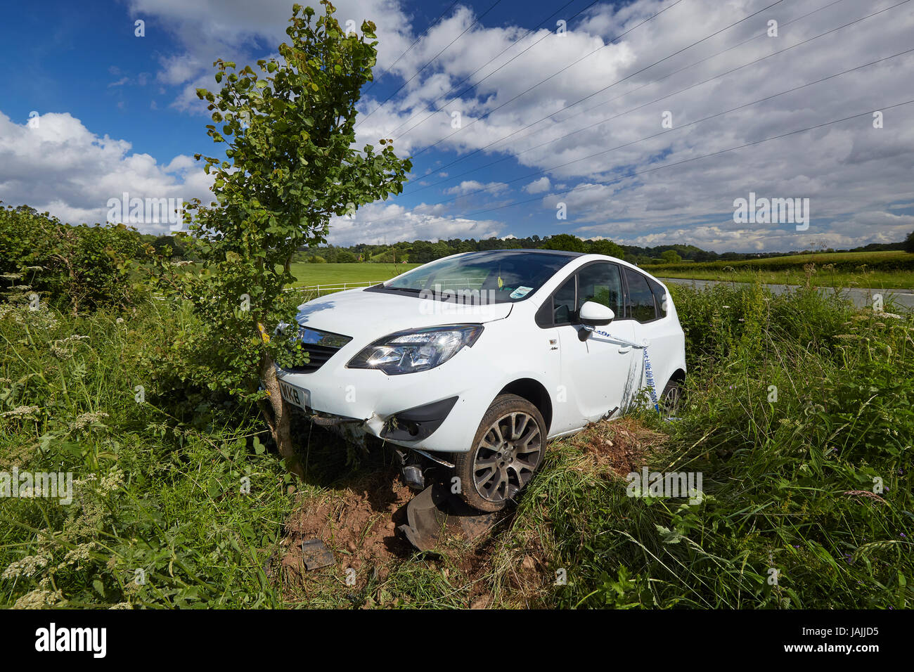 Car Crashed Through Hedge in Rural Location UK Stock Photo - Alamy