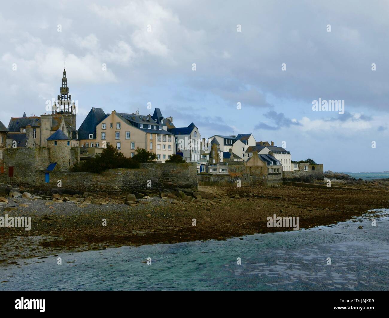 Seaside buildings in the city's old quarter on a stormy day. Roscoff ...