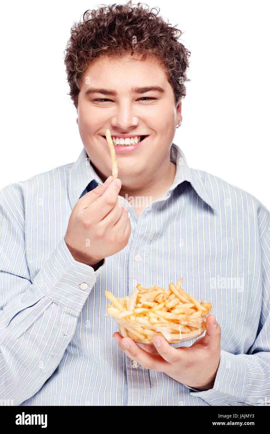 Happy young chubby man with french fries in dish, isolate on white ...