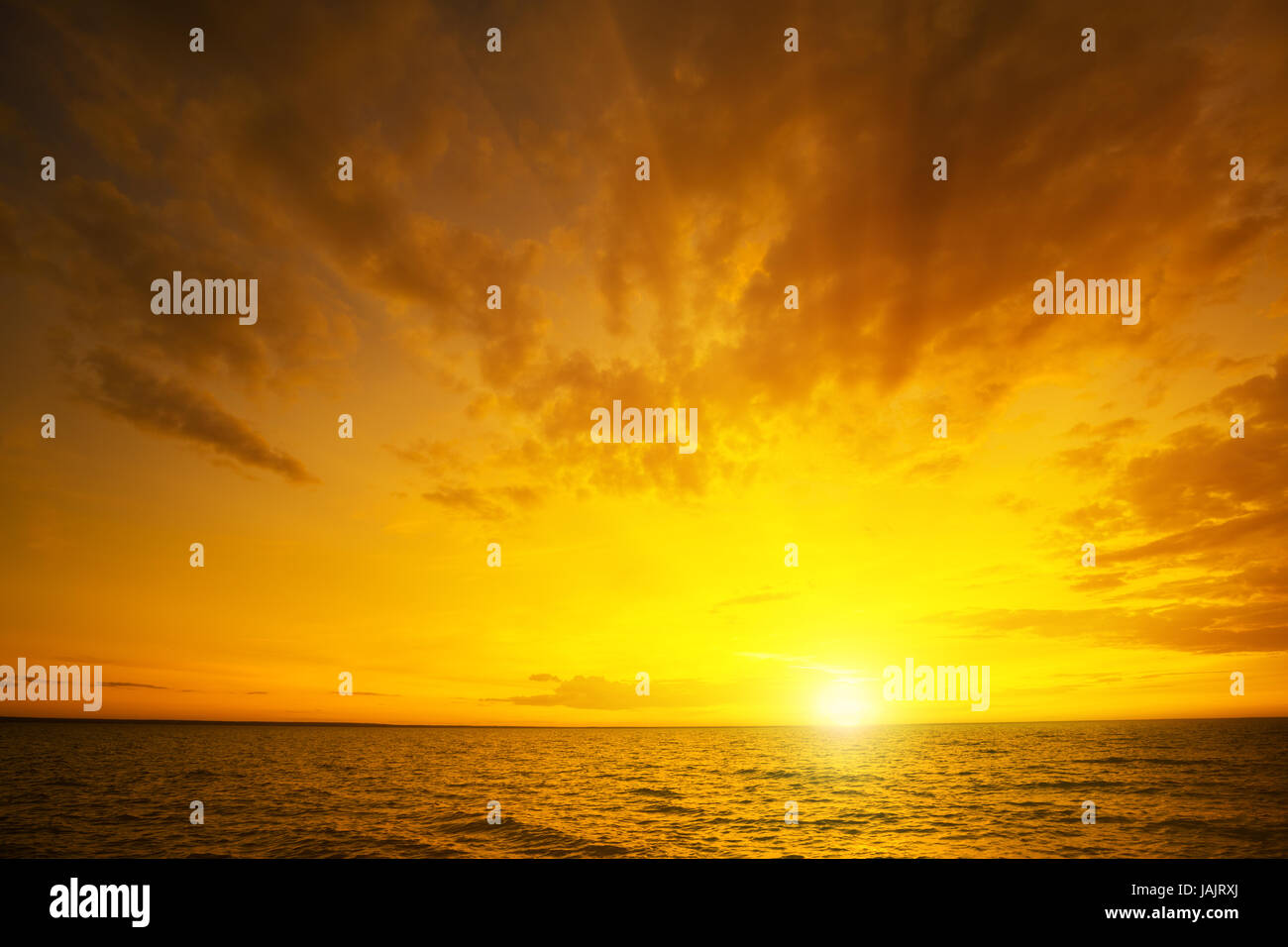 Magic golden sunset over the sea Stock Photo - Alamy