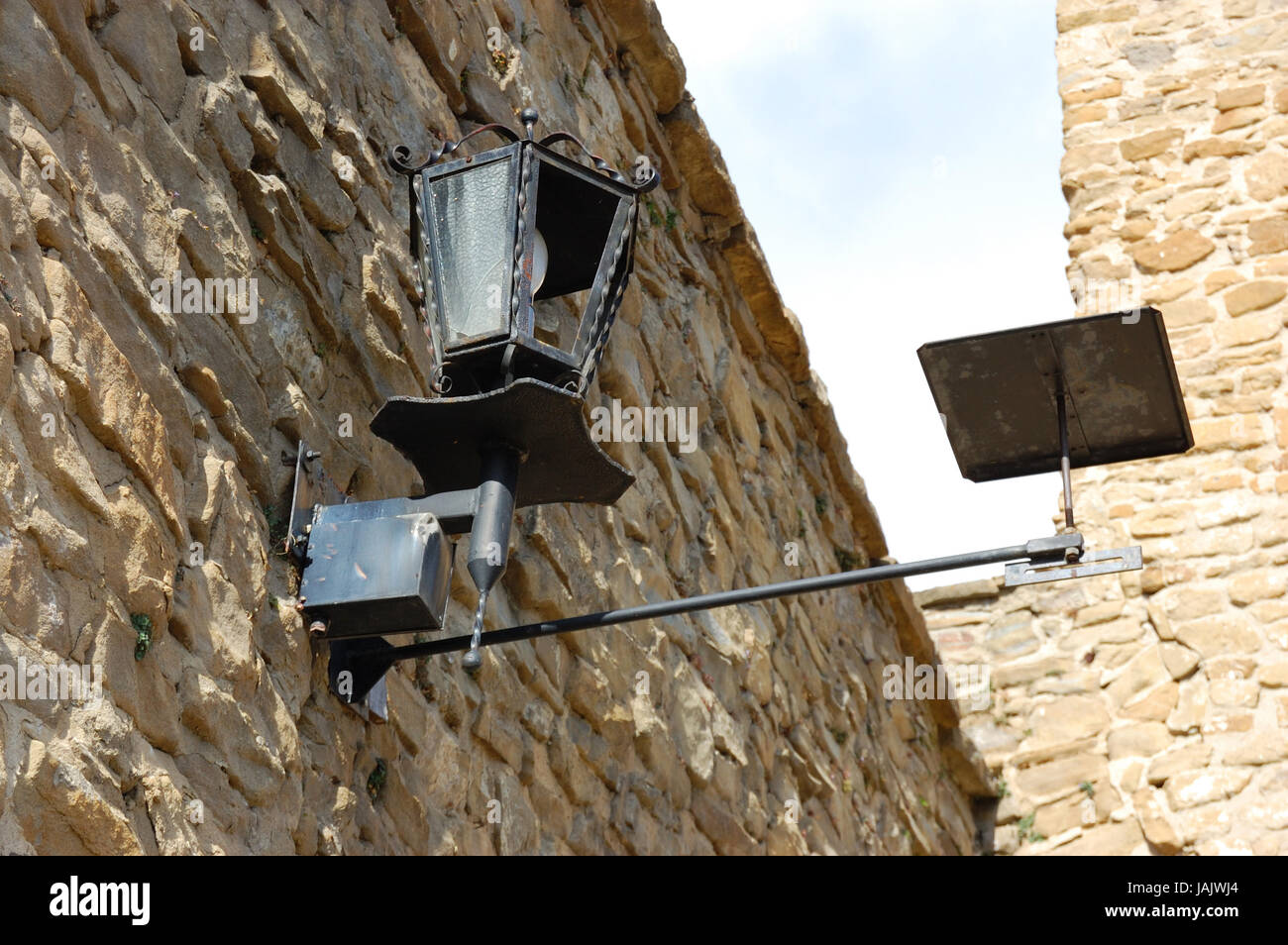 Solar lamp on medieval city walls Stock Photo - Alamy